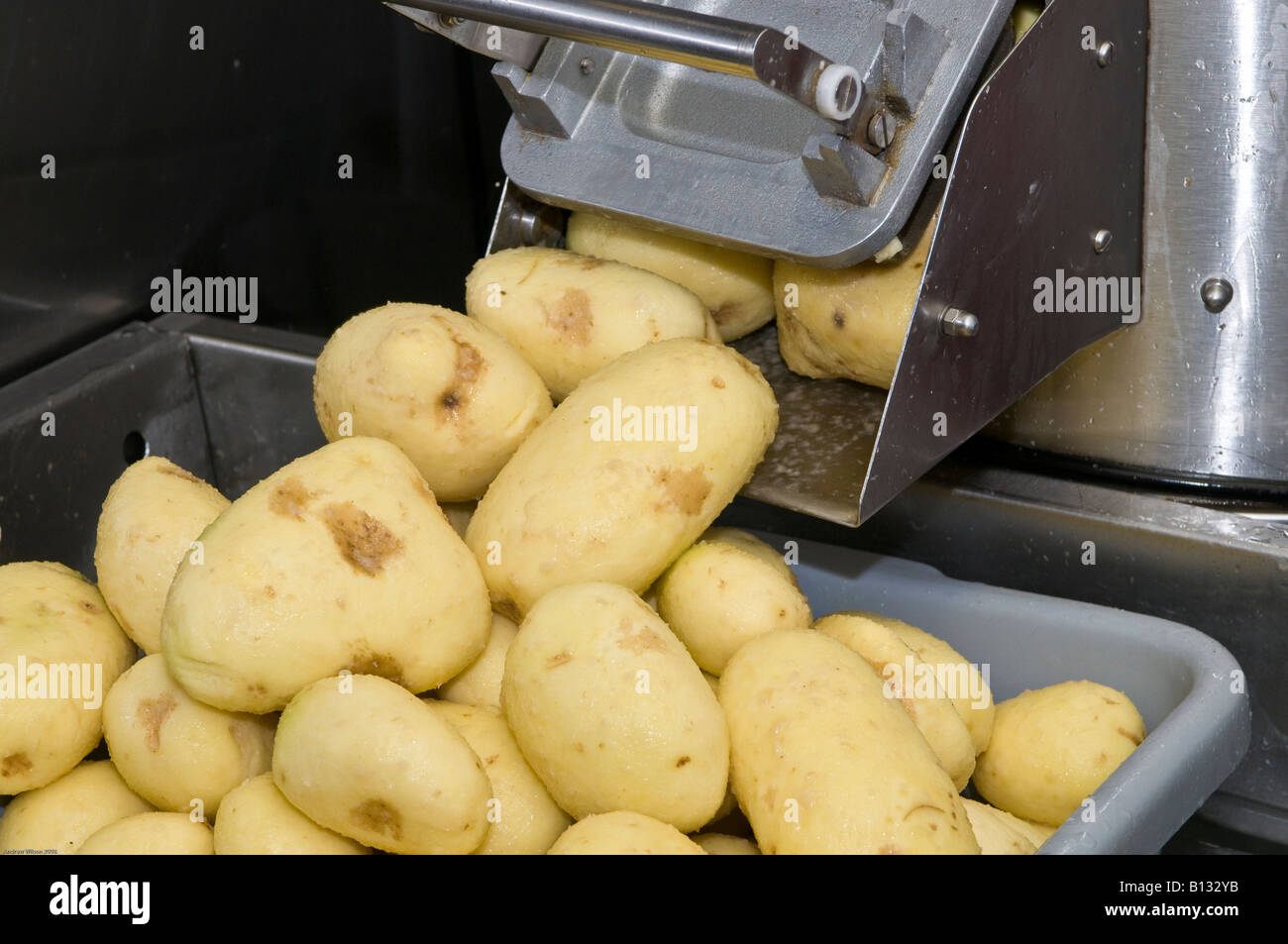 Potatoes about to be made into chips Stock Photo - Alamy