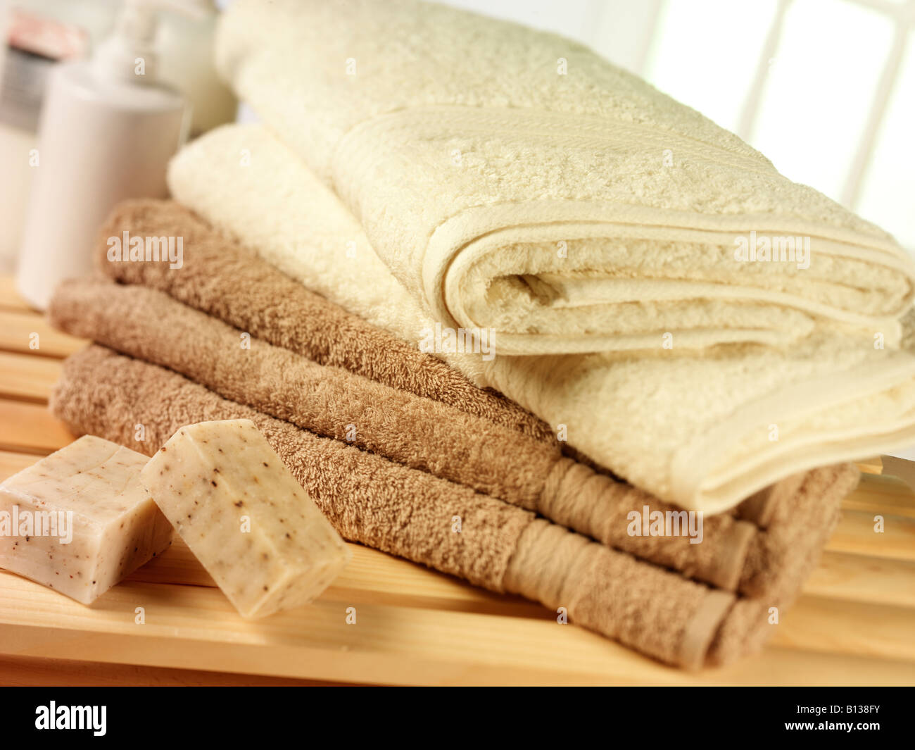 BEIGE AND CREAM BATHROOM TOWELS WITH SOAP BAR Stock Photo - Alamy