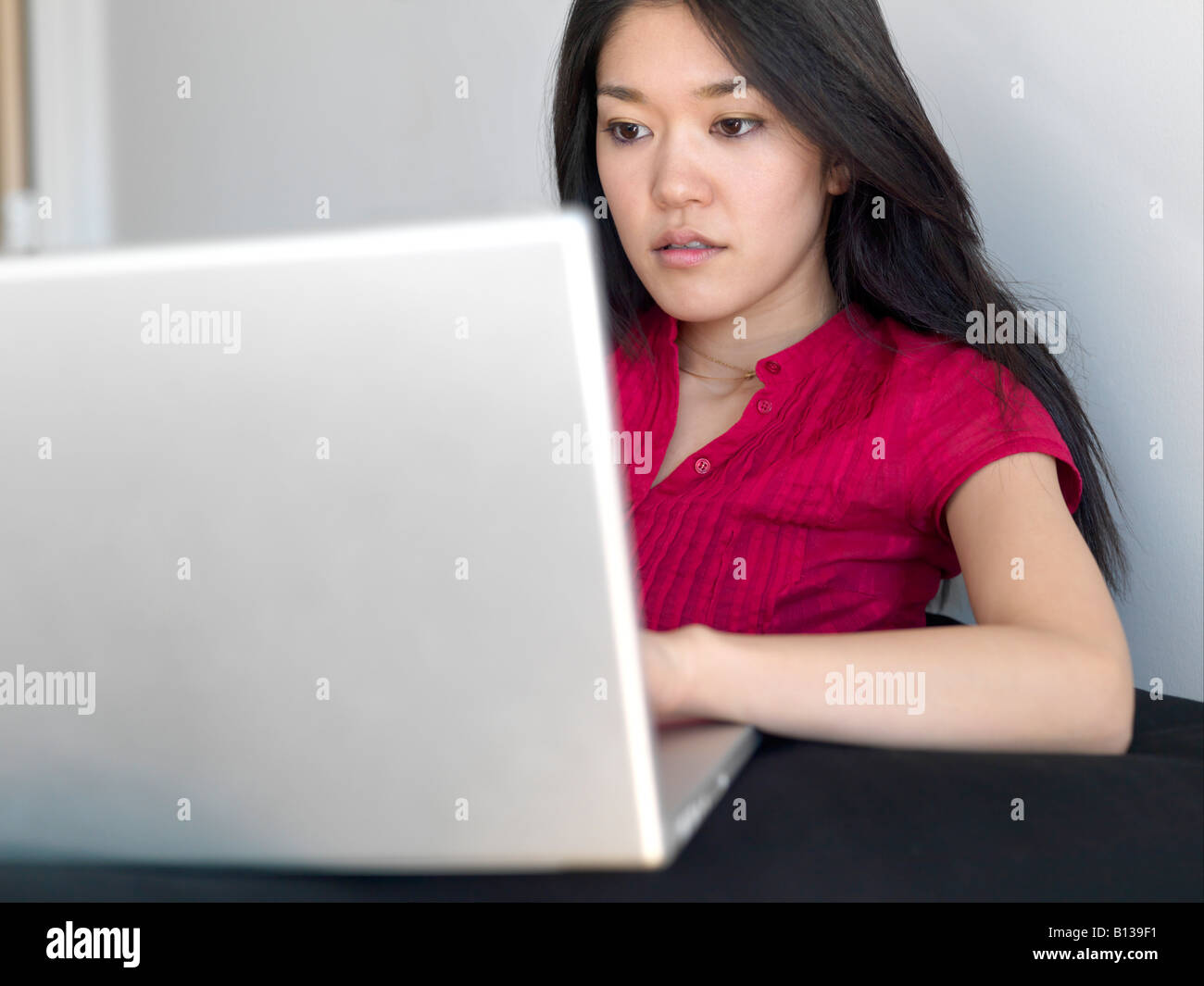 Young Asian women using laptop computer Stock Photo - Alamy