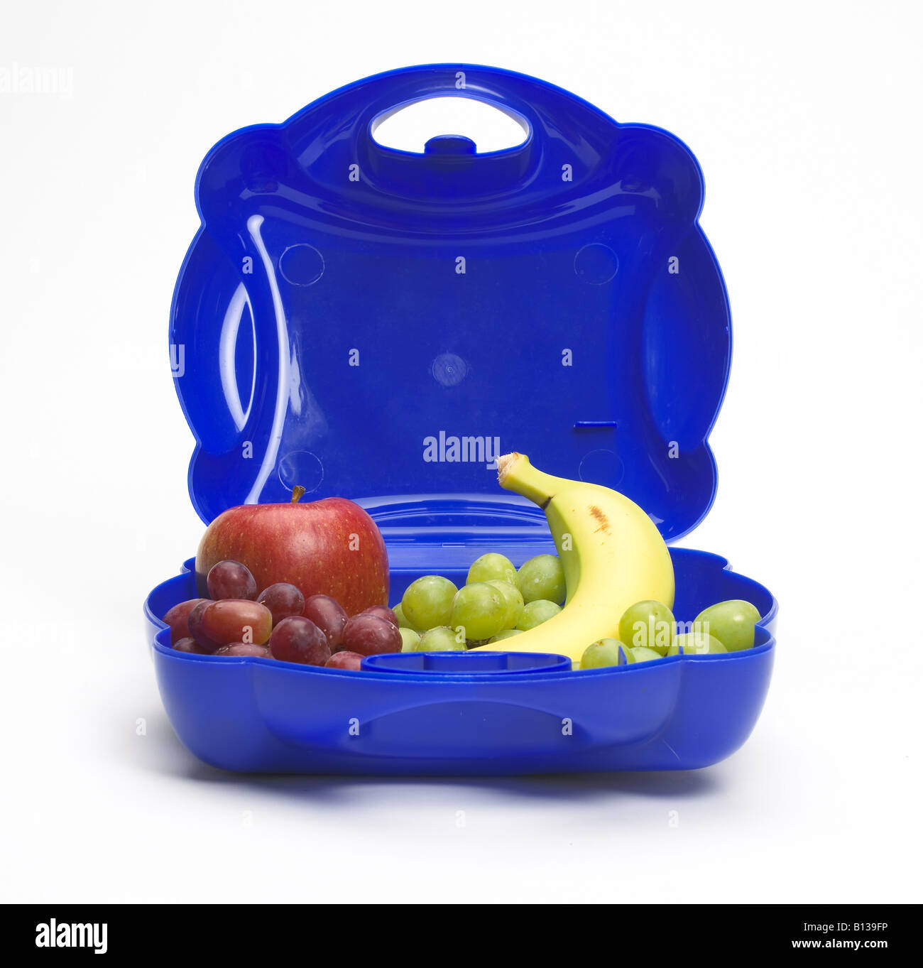 Blue lunch box filled with fruit Stock Photo - Alamy
