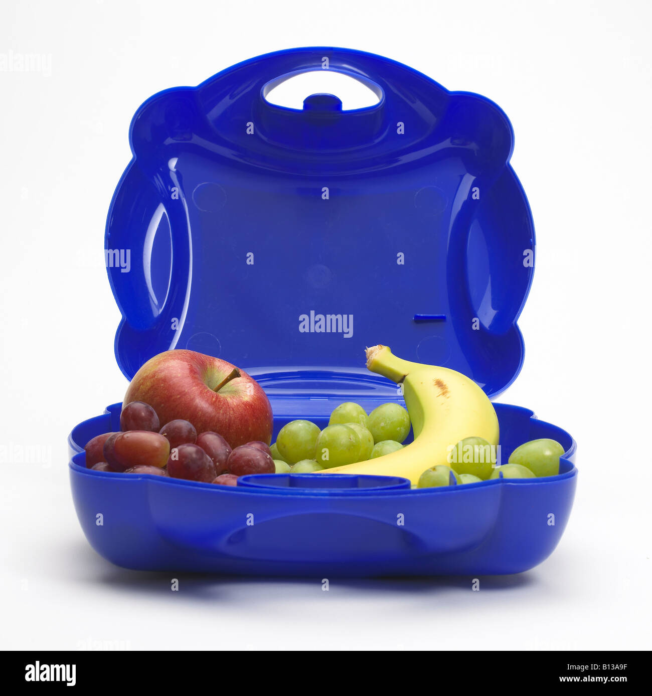 Blue lunch box filled with fruit Stock Photo - Alamy