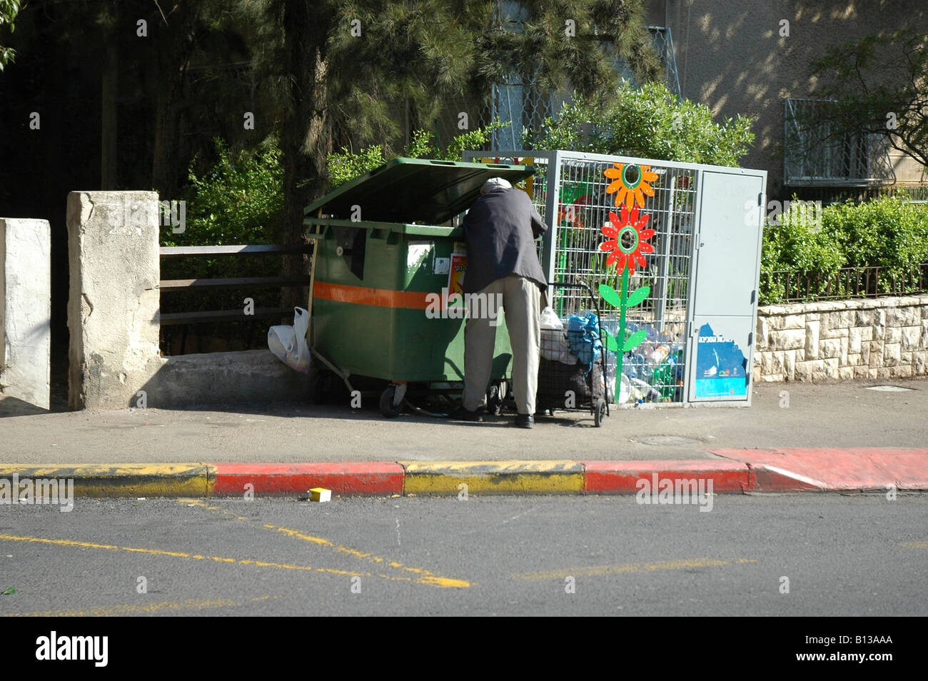 Israel Haifa homeless man searching in a househols waste bin Stock ...