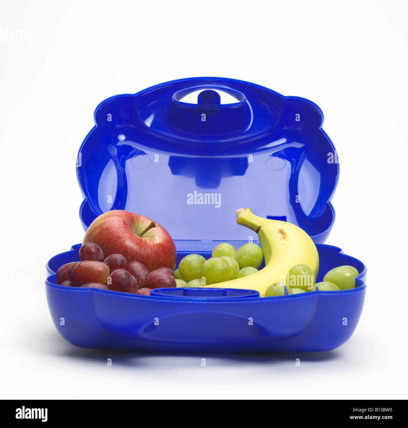 Blue lunch box filled with fruit Stock Photo - Alamy