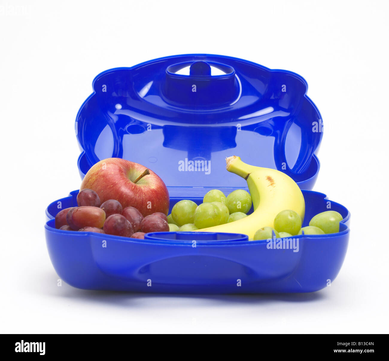 Blue lunch box filled with fruit Stock Photo - Alamy