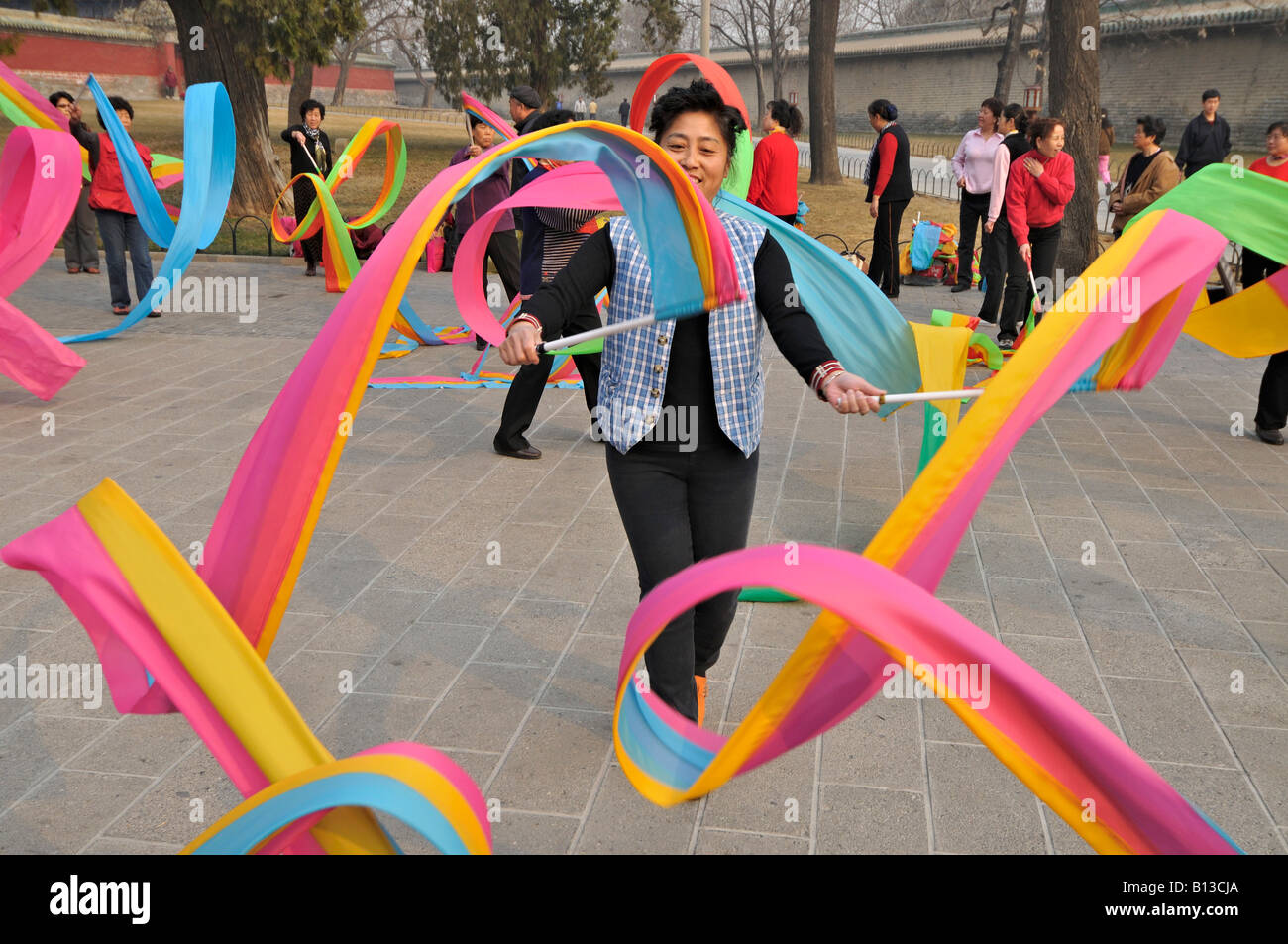 Chinese ladies practising their baton twirling in the early morning in ...