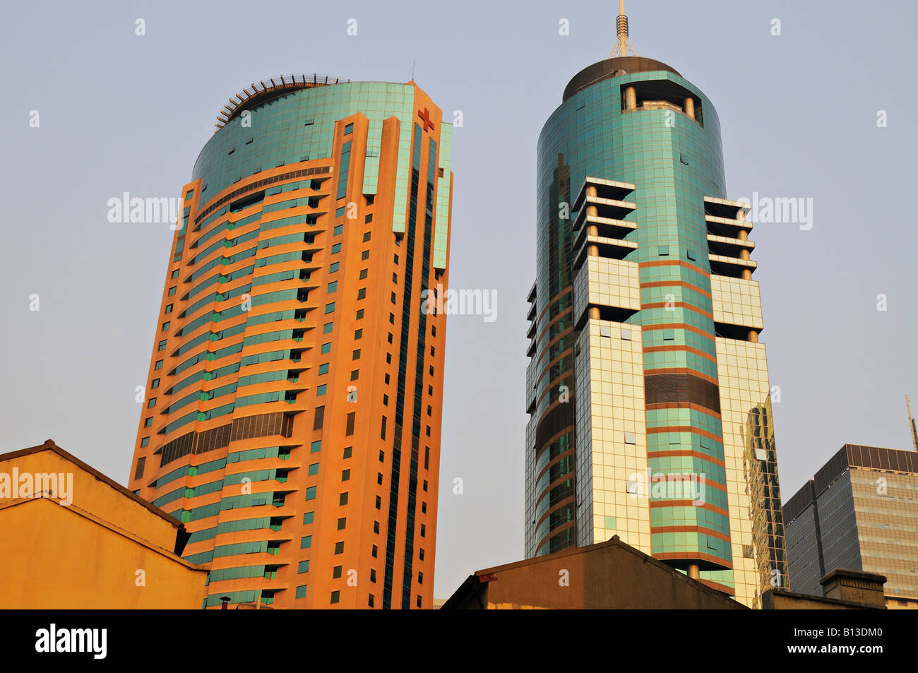 Modern skyscrapers rise above older low rise houses Shanghai China ...