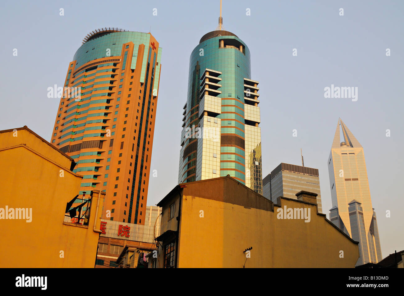 Modern skyscrapers rise above older low rise houses Shanghai China ...
