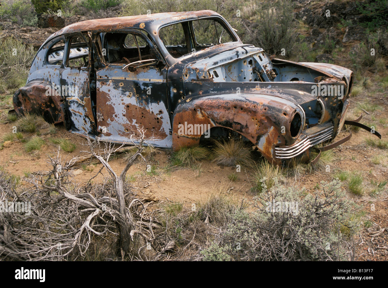 Bullet ridden car carcass near Highway 20 in southeast Oregon Stock ...