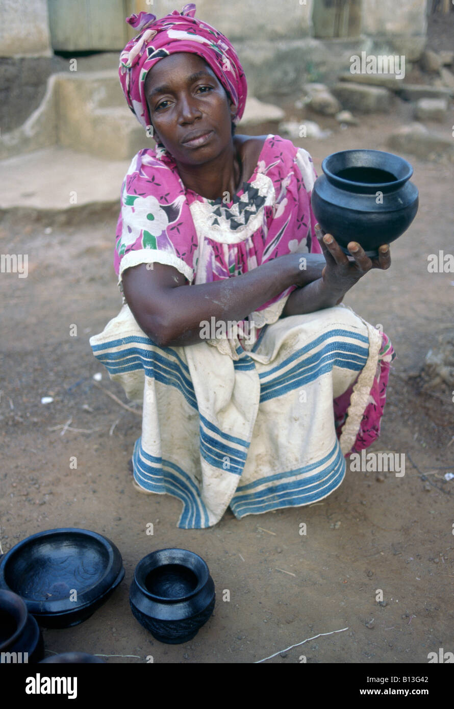 A village woman with pottery, Ivory Coast Stock Photo - Alamy