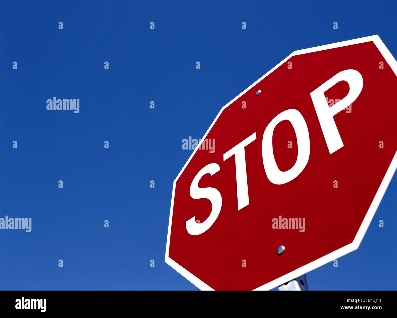 Red stop sign against blue sky Arizona, USA Stock Photo - Alamy