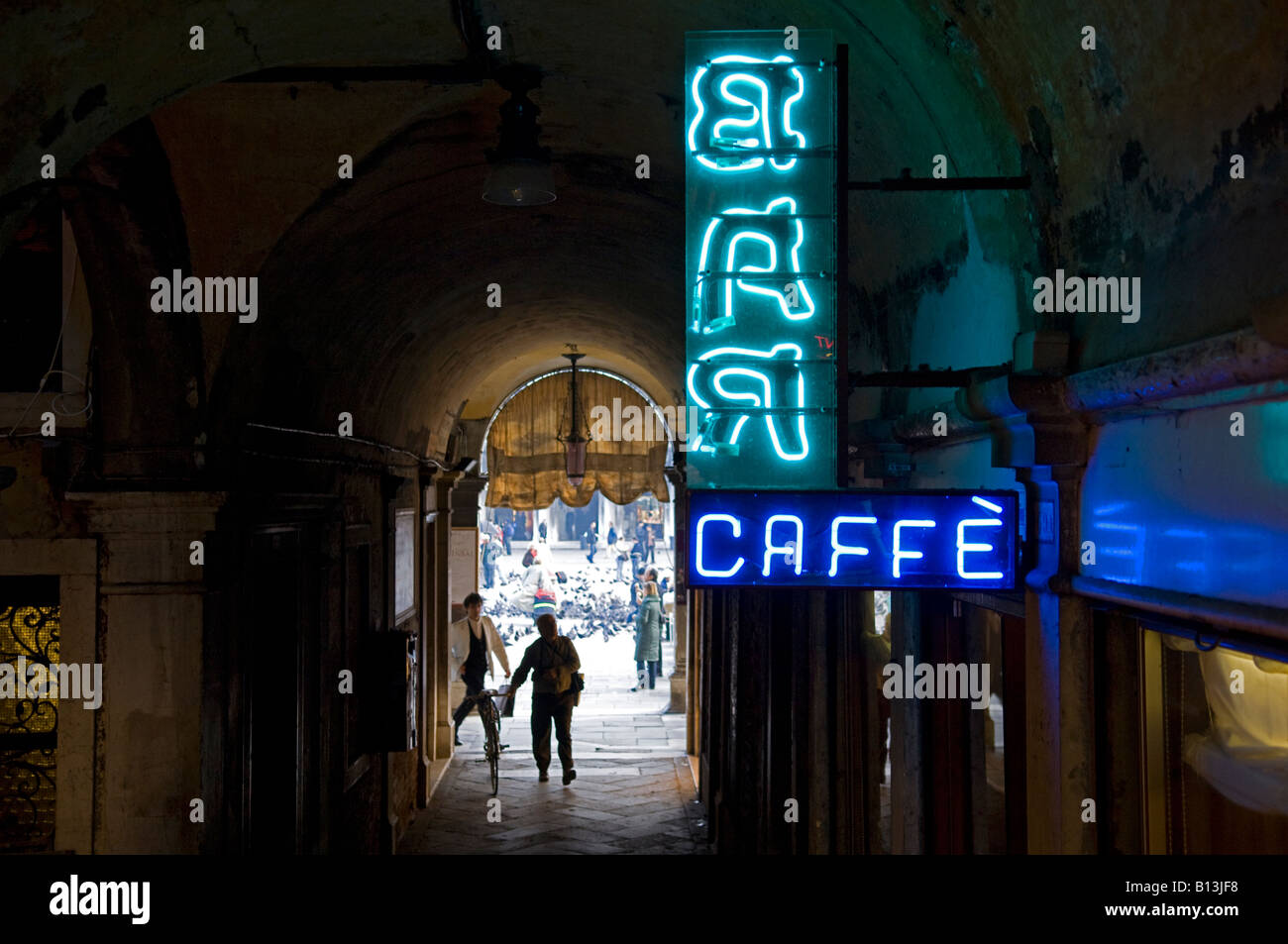 Neon Caffe Sign in a dark alley leading to Saint Marks Square, Venice ...
