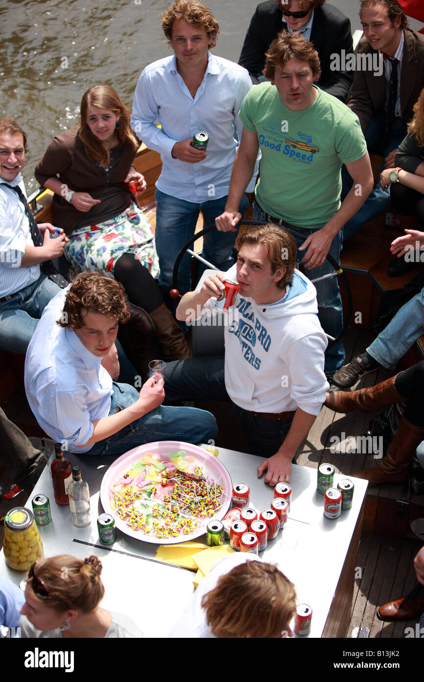 Booze cruisers on the canal in Amsterdam Stock Photo - Alamy