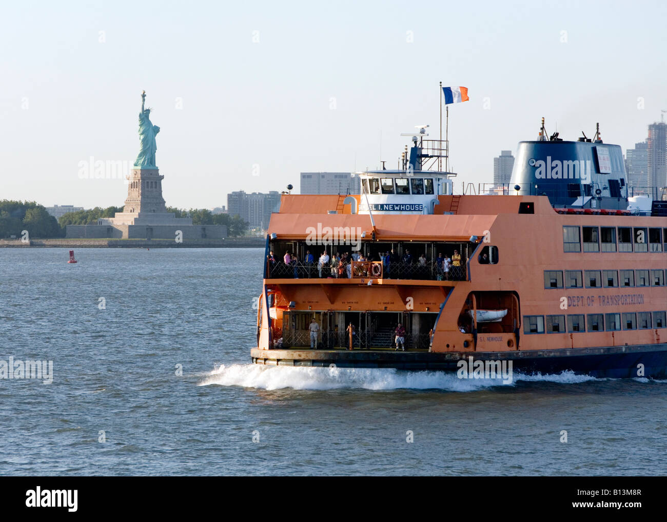 A view of a New York City Commuter Ferry and the Statue of Liberty ...