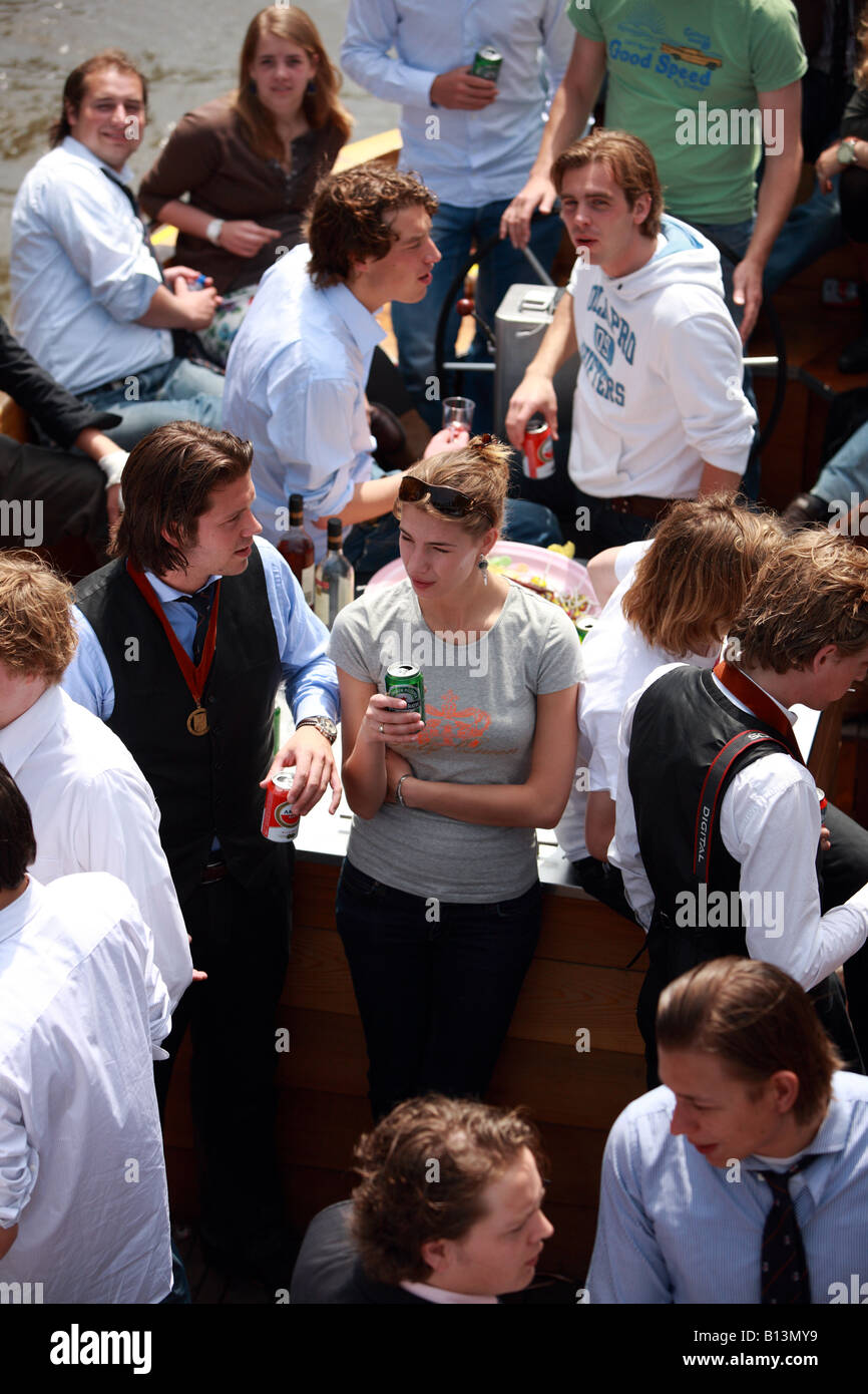 Booze cruisers on the canal in Amsterdam Stock Photo - Alamy