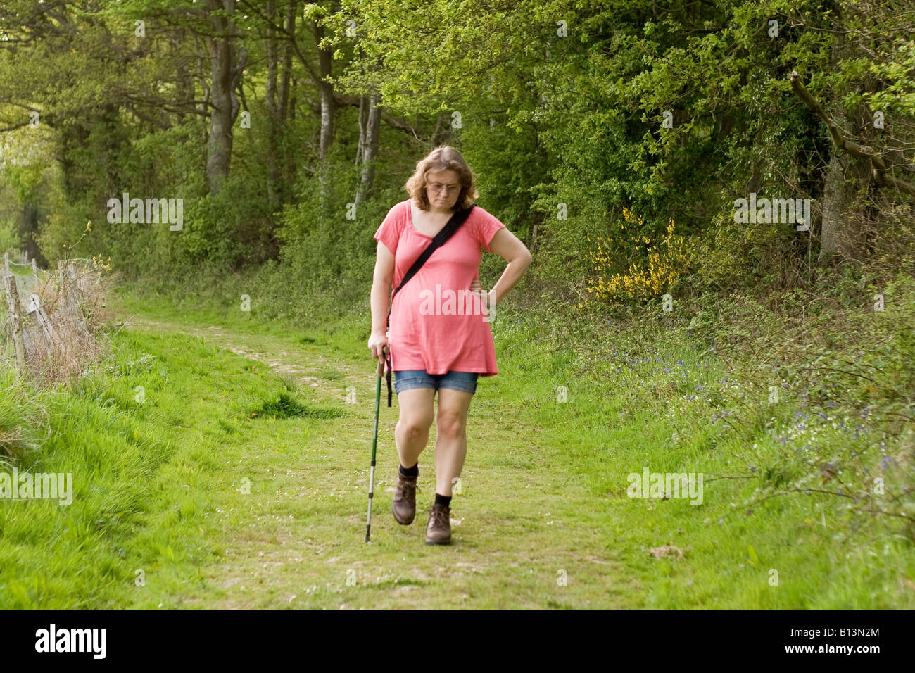 middle aged woman on a walk in wood Stock Photo - Alamy