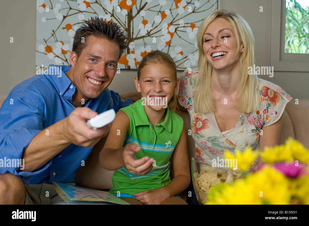 family watching TV Stock Photo - Alamy