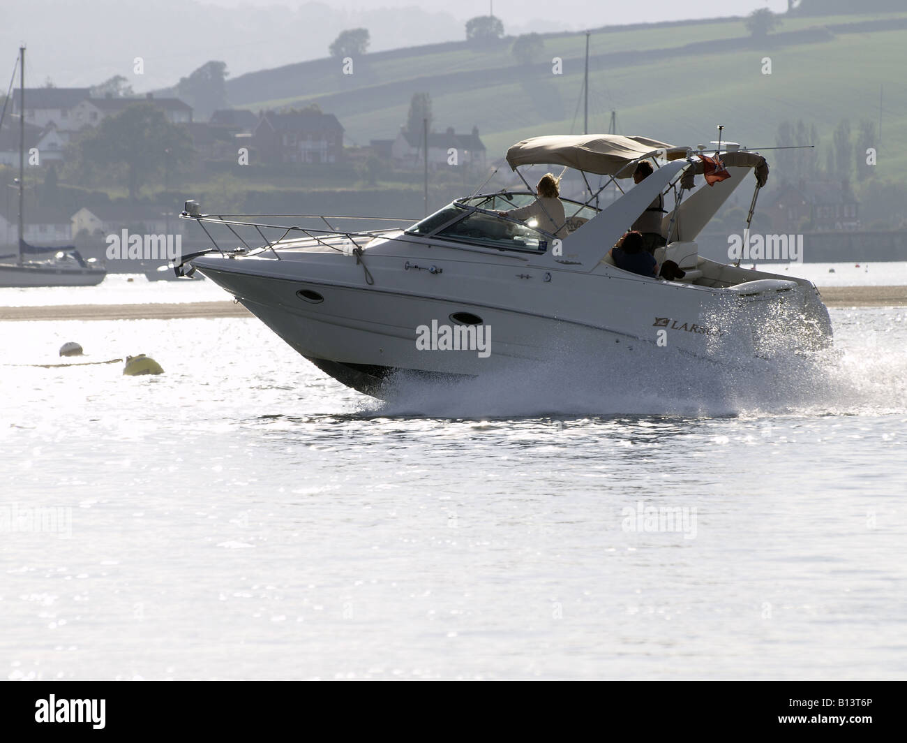 Motorboat, early evening, Devon, UK Stock Photo - Alamy