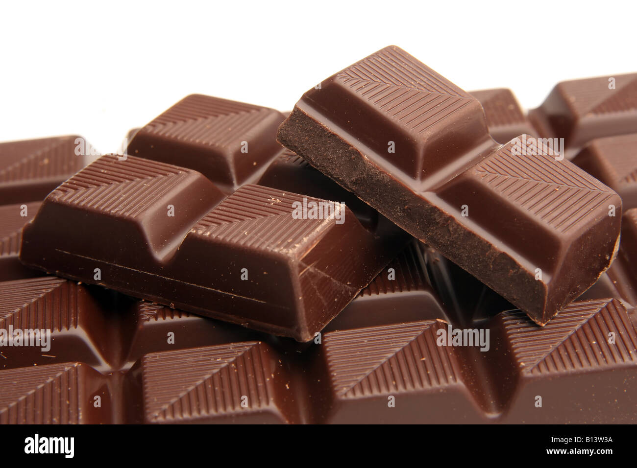 Chocolate pieces on white Stock Photo - Alamy