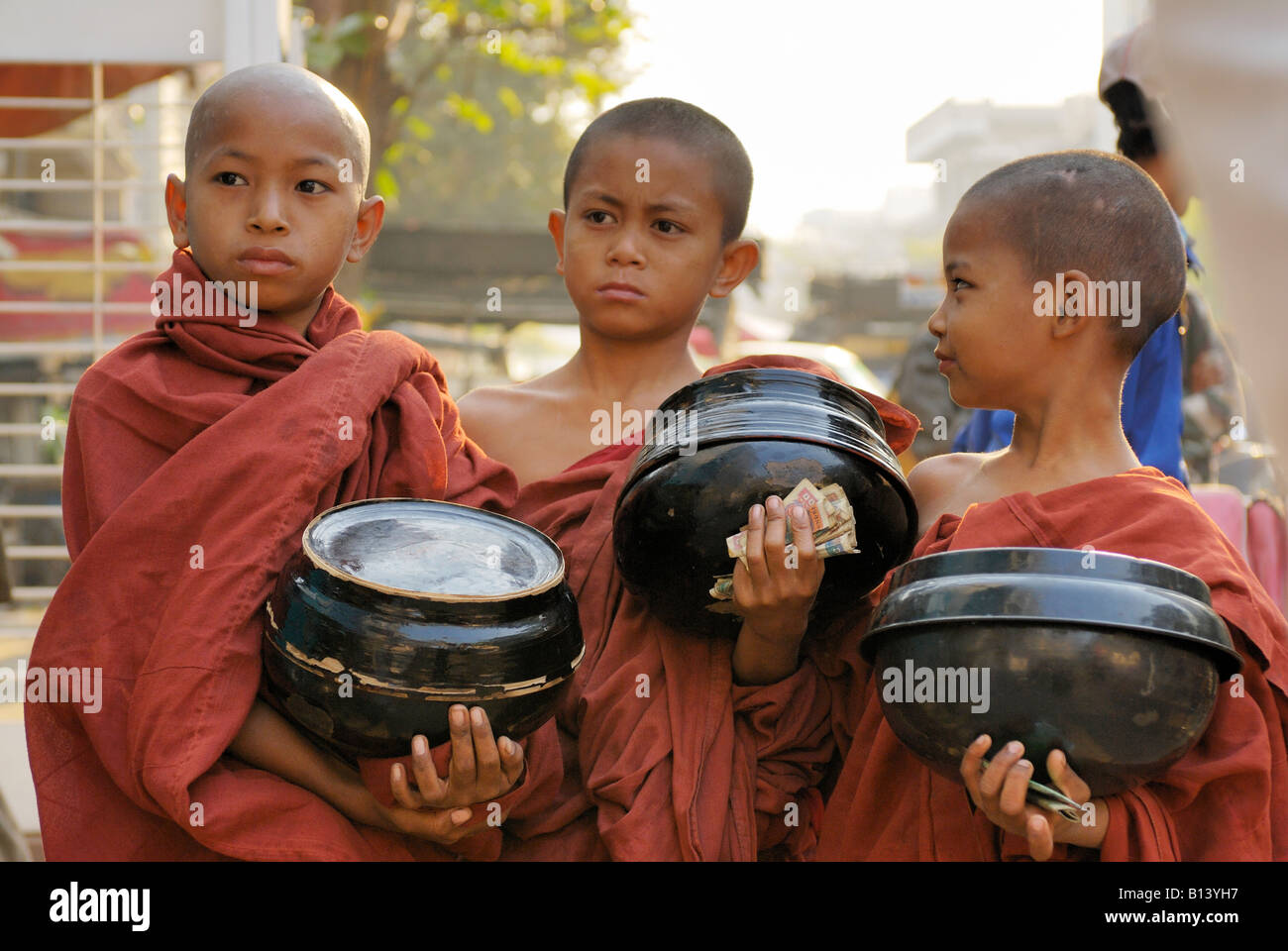 young monks collecting money or food, MANDALAY AMARAPURA, MYANMAR BURMA ...