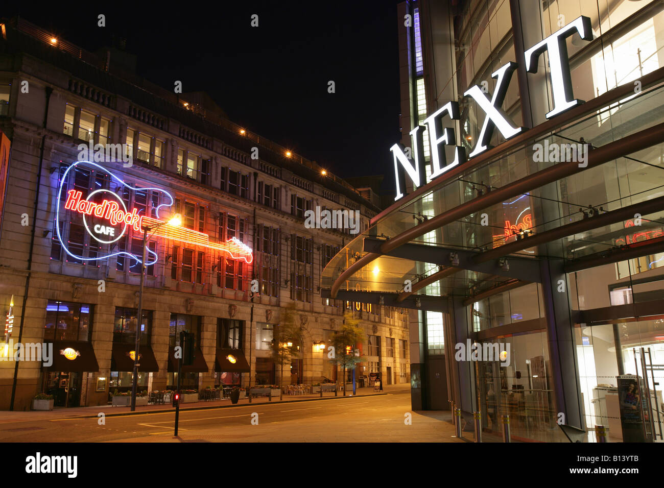City of Manchester, England. Night view of the Next retail store and ...