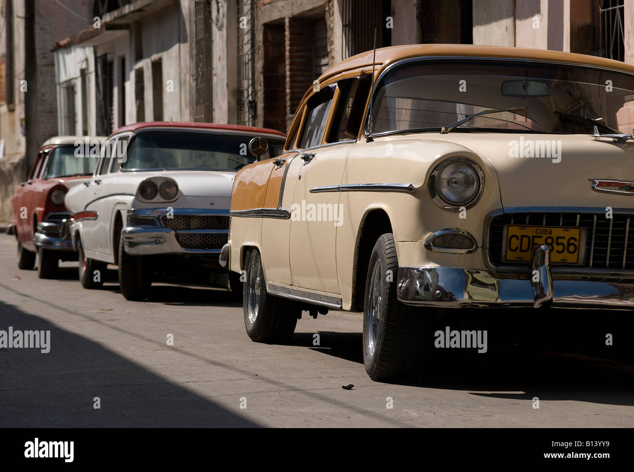 Old american cars on the street in Camagüey Stock Photo - Alamy