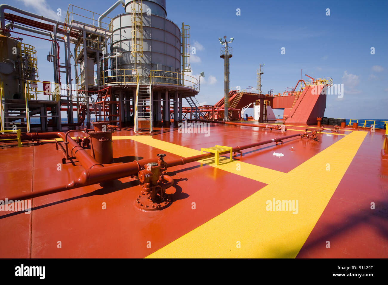 Yellow safe route markings on a FPSO. Natuna Anoa Field, Indonesia ...