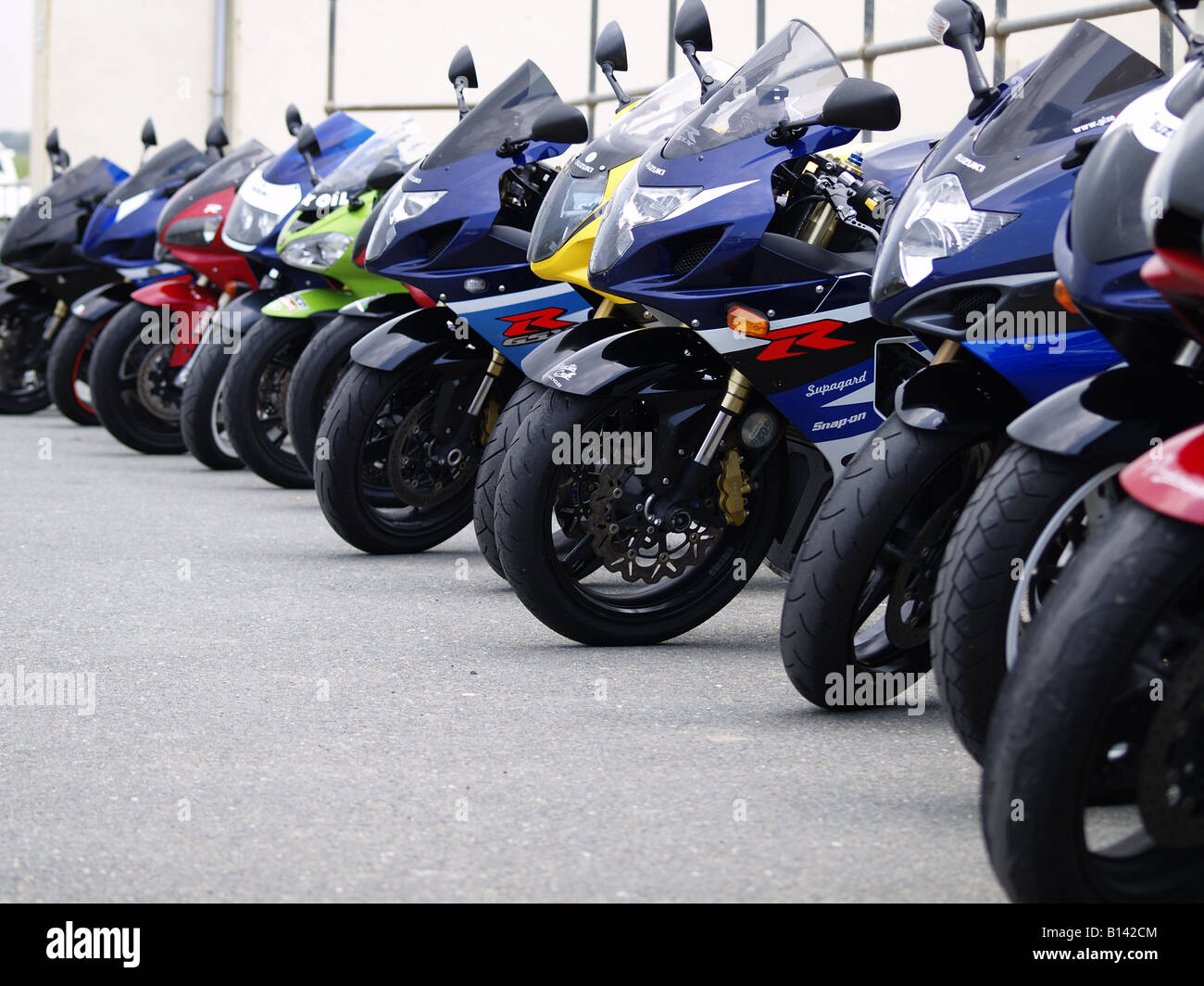 A row of motorbikes all parked up together Stock Photo - Alamy
