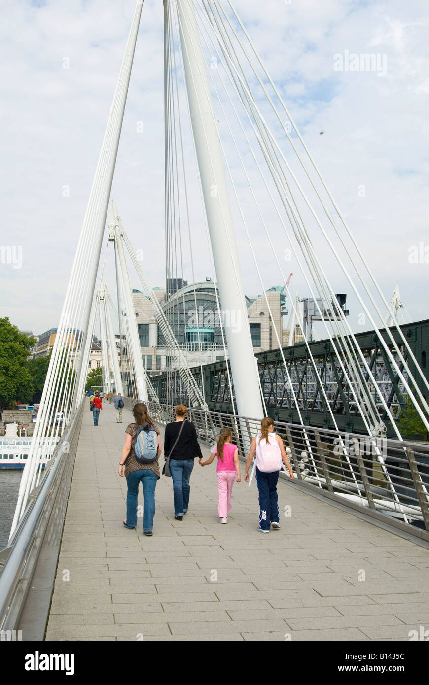 People walking across Jubilee Bridge, London, U.K Stock Photo - Alamy