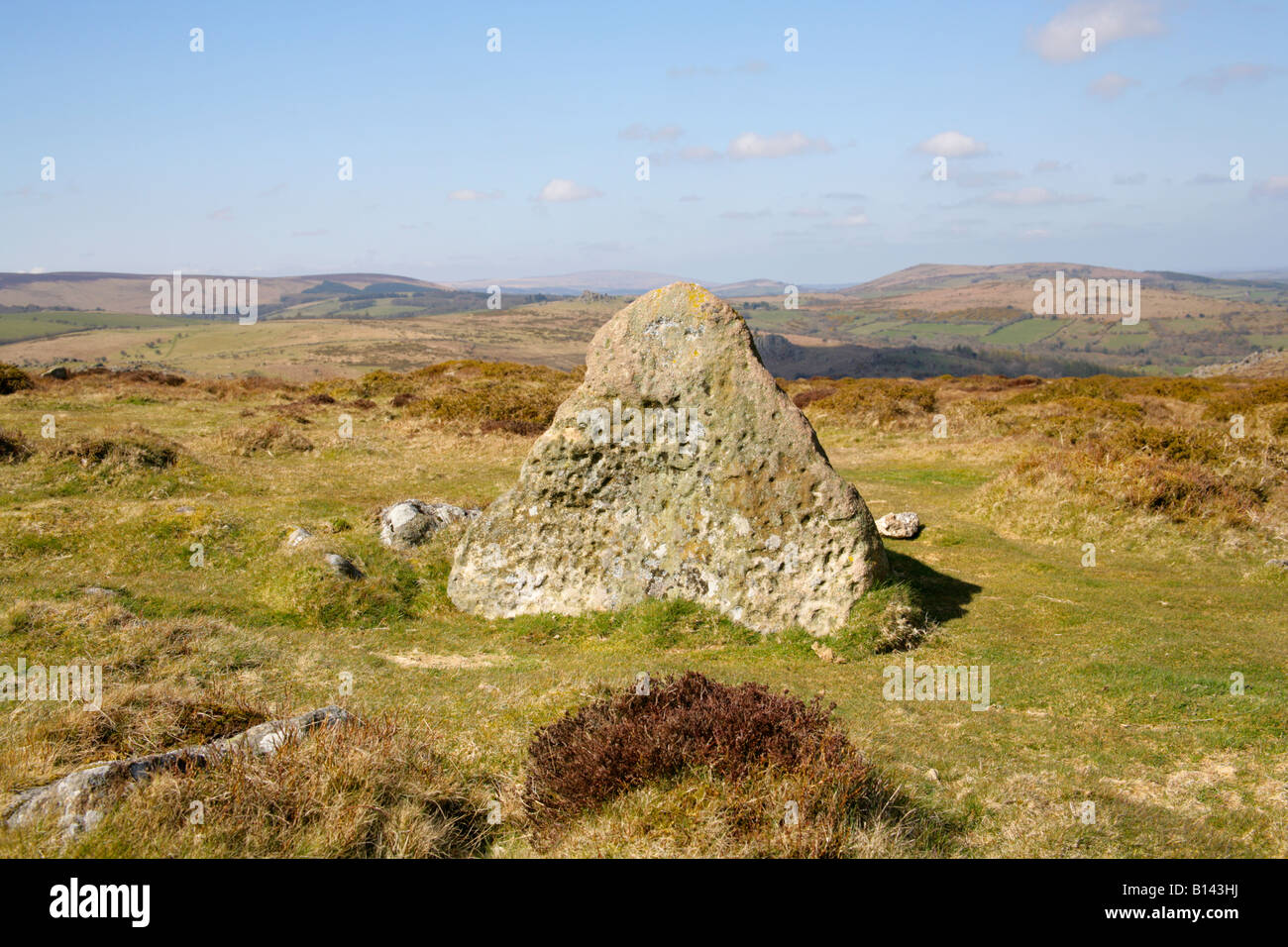 Standing granite stone on Haytor Rocks pointing to view across Dartmoor ...