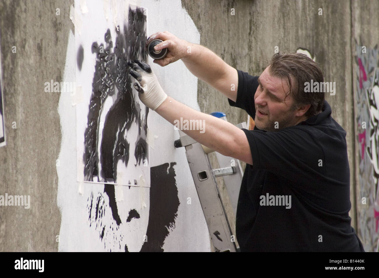 Someone Spray Painting A Wall