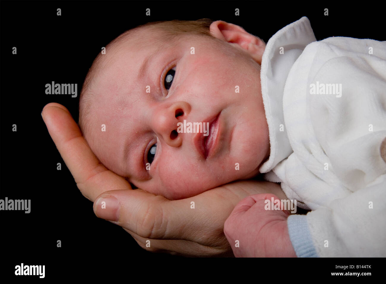 baby lying on arm Stock Photo - Alamy