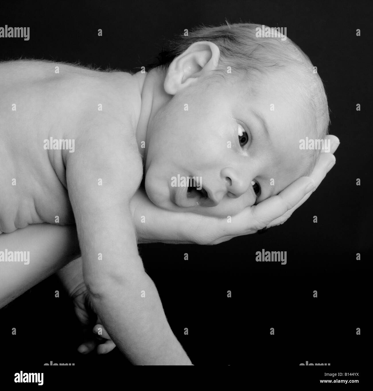 baby lying on arm Stock Photo - Alamy