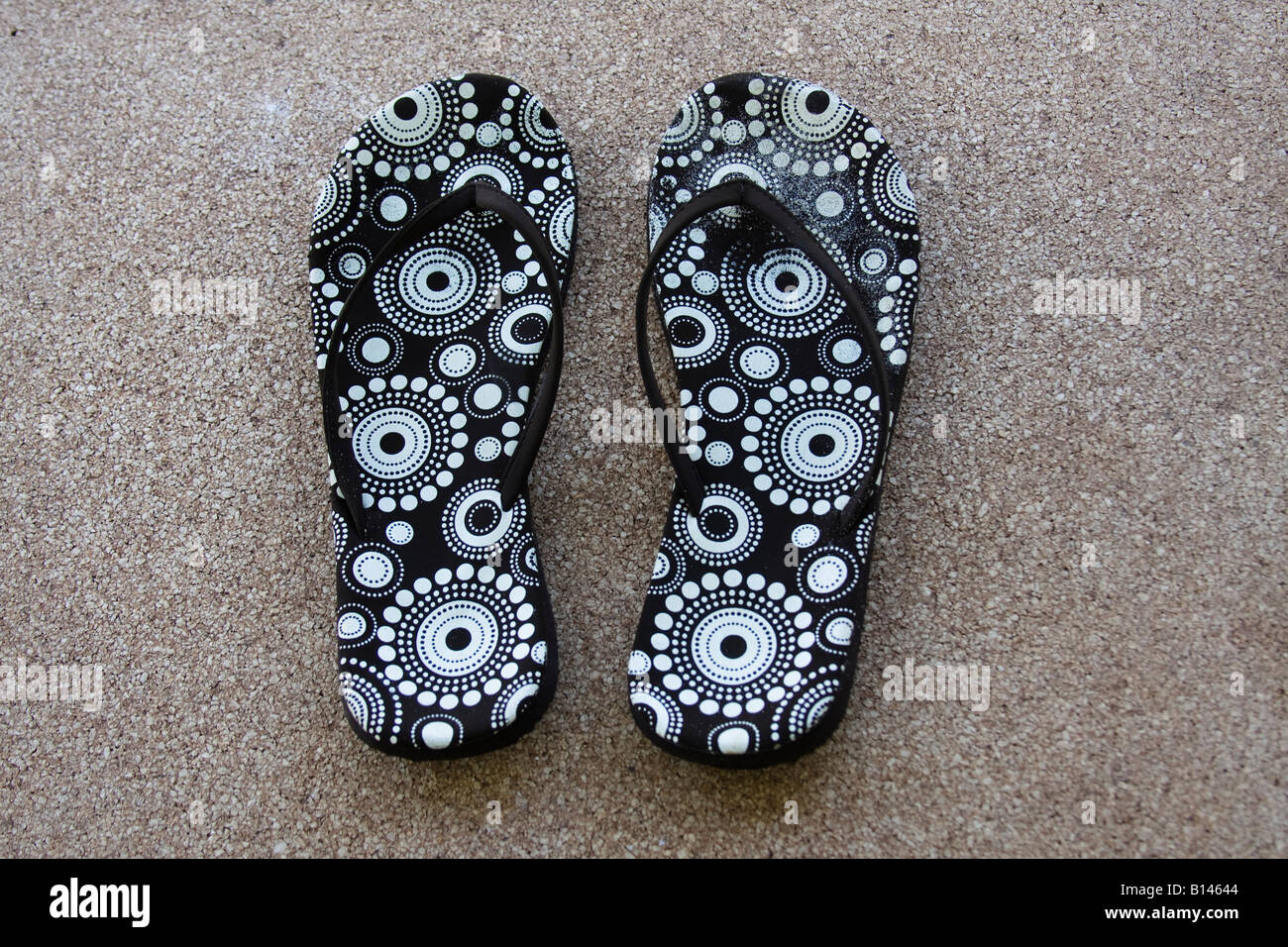 High angle view of flip flops in the sand Stock Photo - Alamy