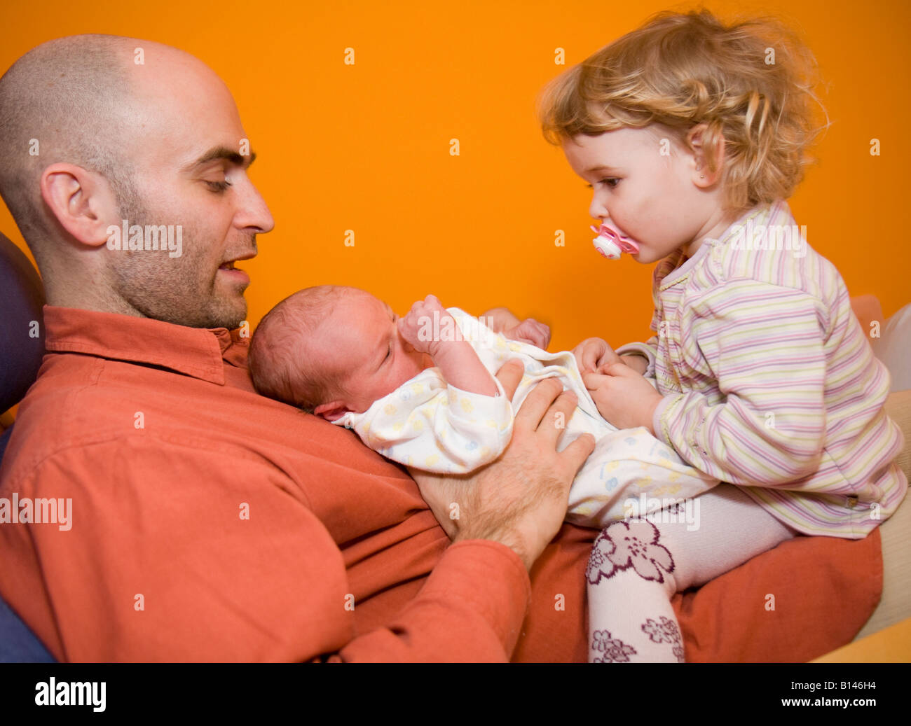 father and daugther with new born Stock Photo - Alamy