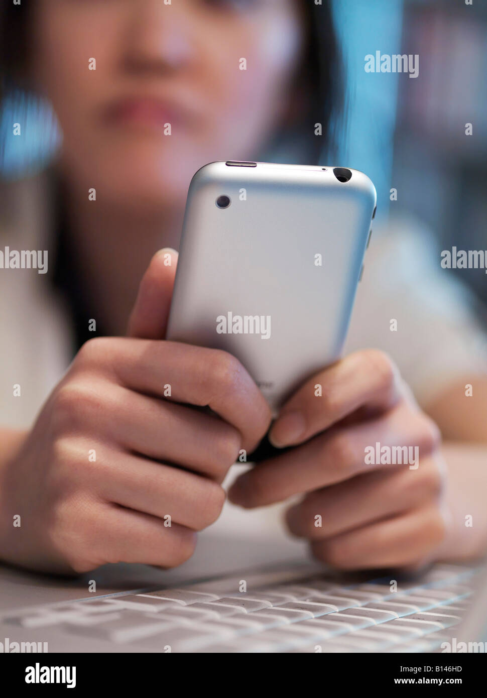 Young Asian women using mobile phone Stock Photo - Alamy