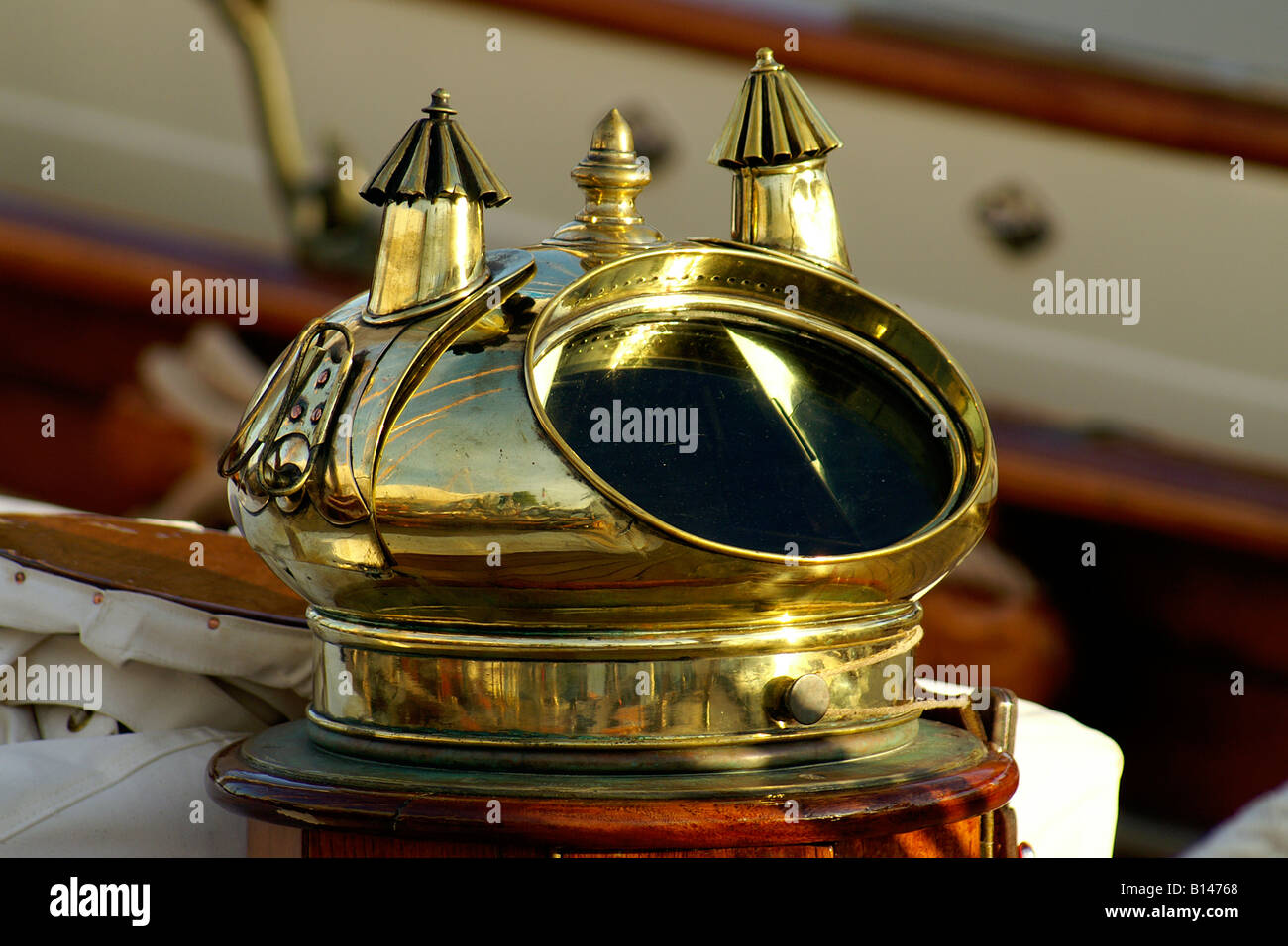 The shining brass compass of an old classic yacht Stock Photo - Alamy