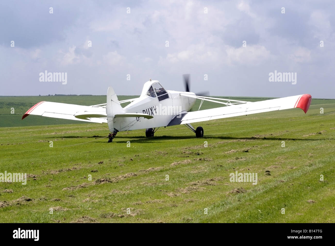 Crop spraying aircraft on a grass runway prepares for take off Stock ...