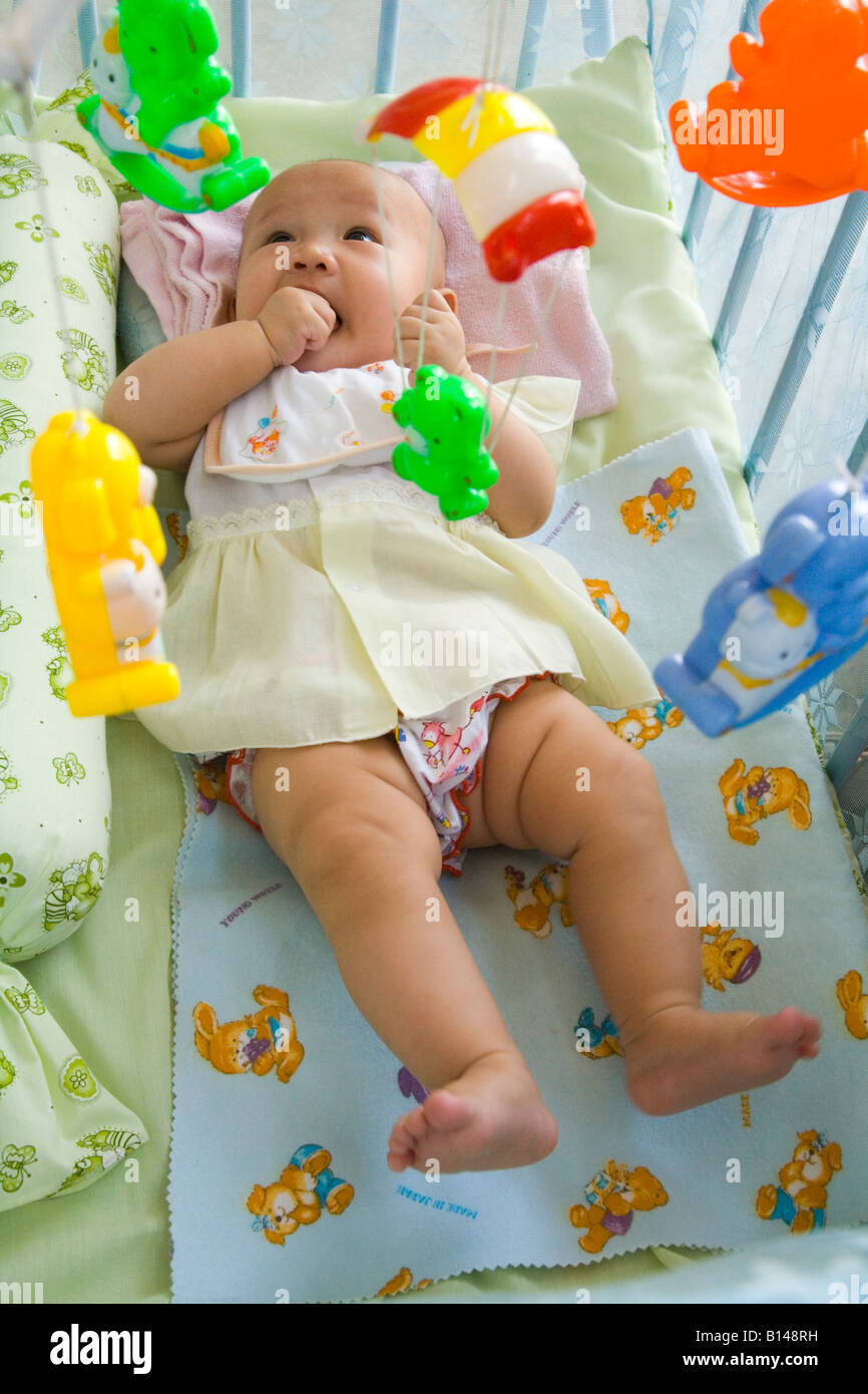baby in cot Stock Photo - Alamy
