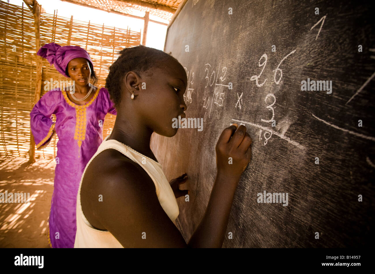 Female teacher giving math class Stock Photo - Alamy