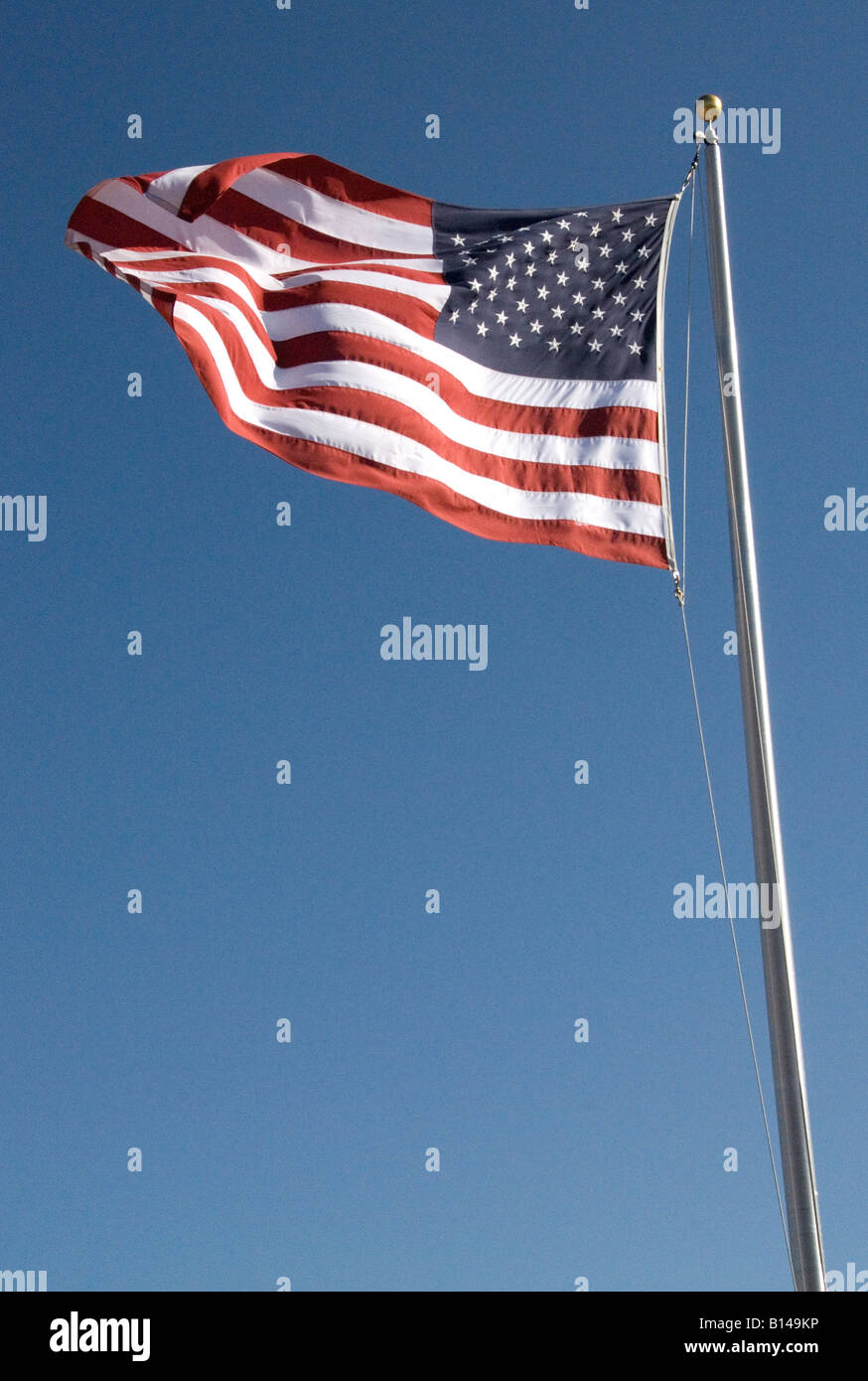American flag blowing in the wind Stock Photo - Alamy