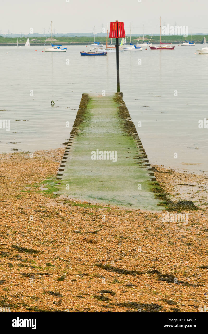 Causeway looking out into the River Medway, Kent, England, UK. Portrait ...