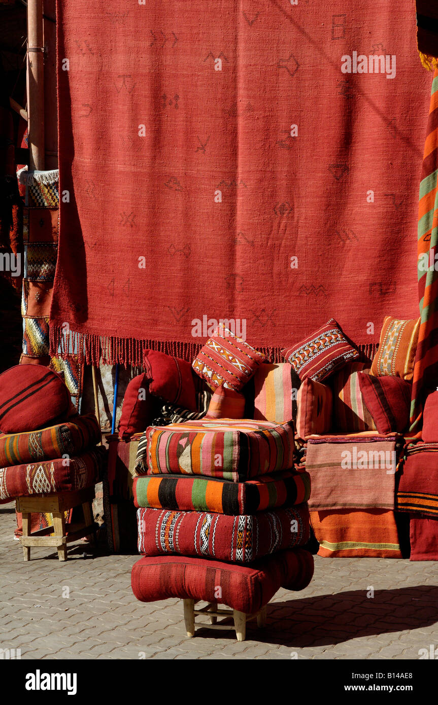 Carpets stacked for sale in the Marrakech Souk, Morocco Stock Photo - Alamy
