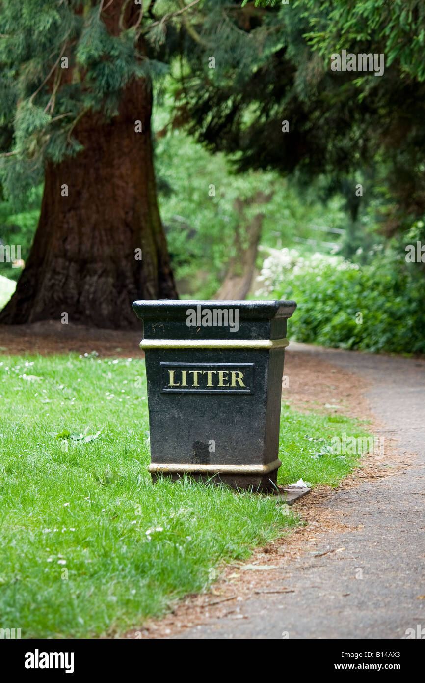 Black litter bin with gold lettering located in an English park Stock ...