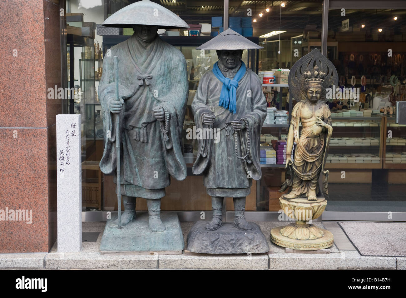 Kyoto, Japan. Statues of gods for sale outside a religious supplies ...