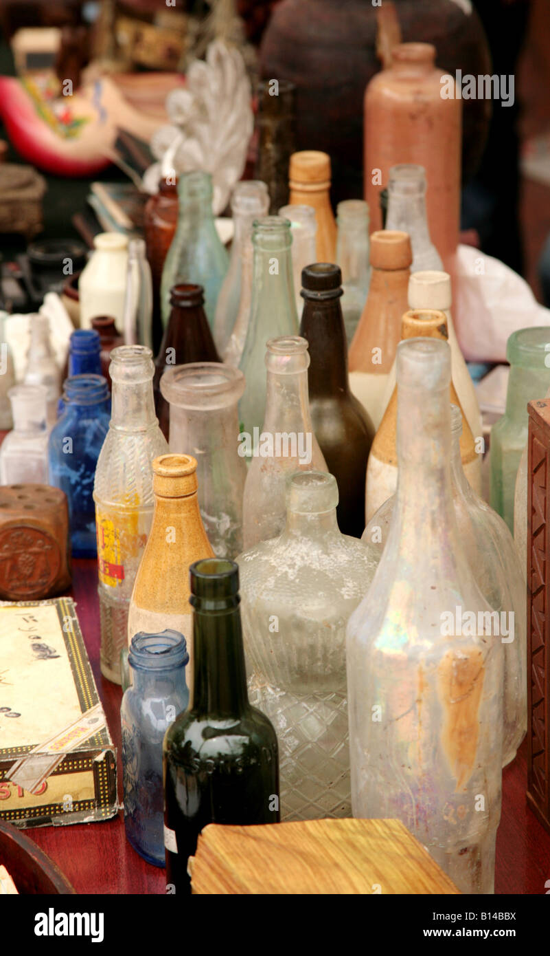 Antique bottles on sale at a street market Stock Photo - Alamy