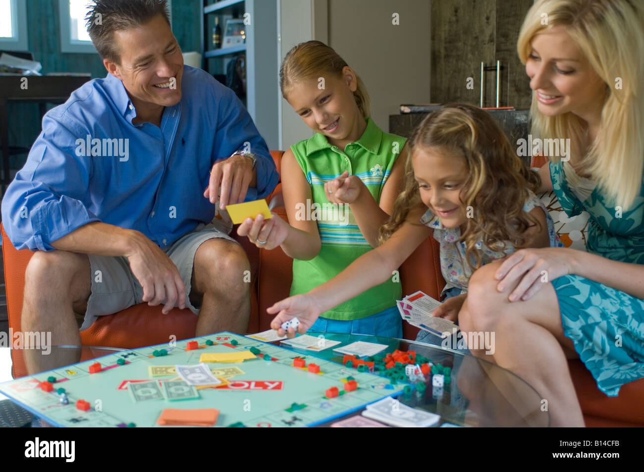 Family at home playing Stock Photo - Alamy