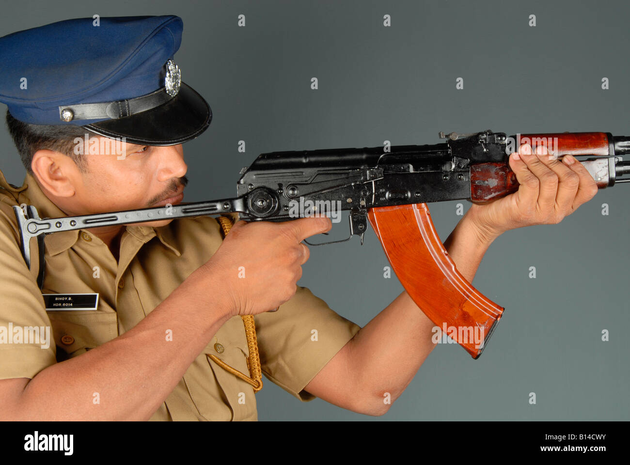 Indian Police Officer With Gun