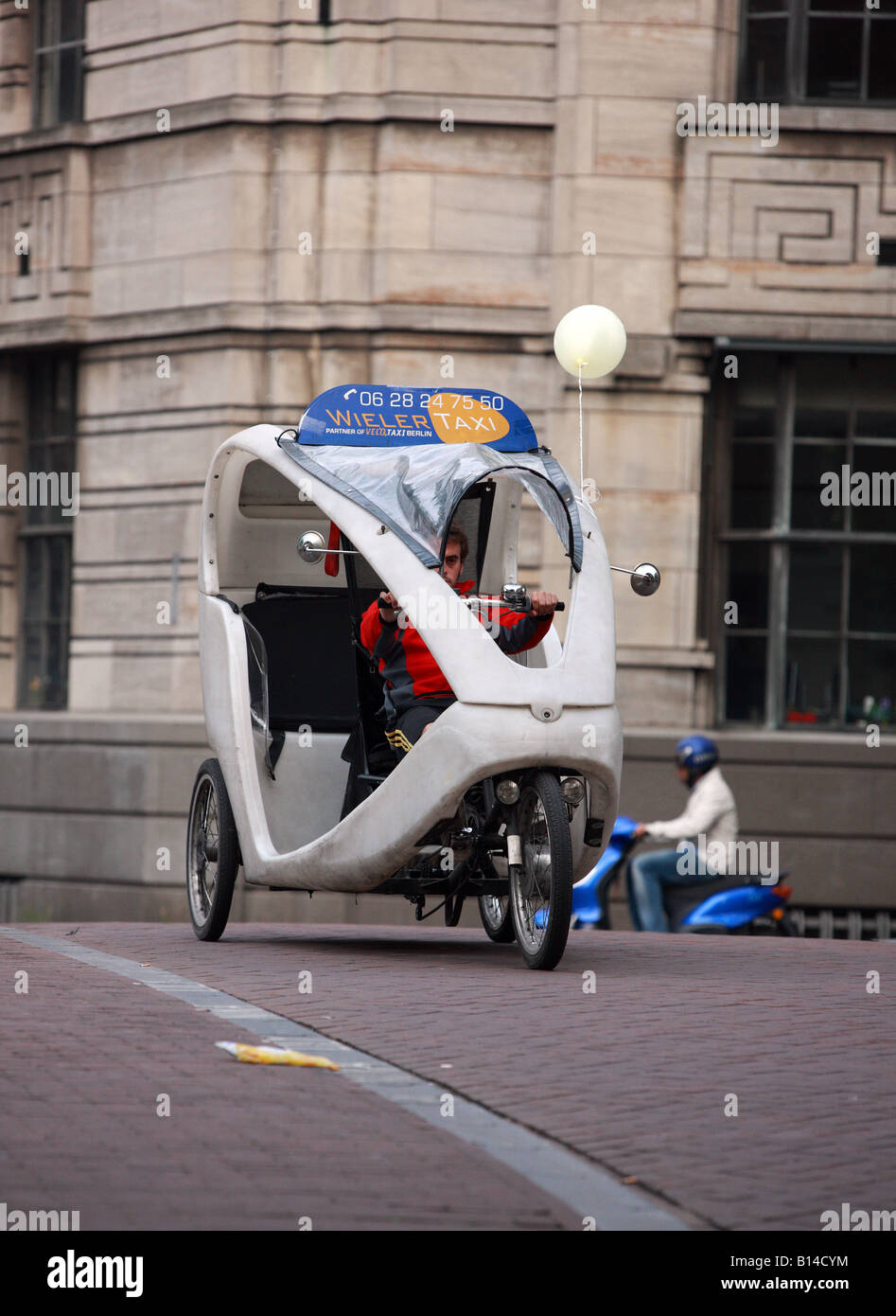 Bicycle taxi, on the streets of Amsterdam Stock Photo - Alamy