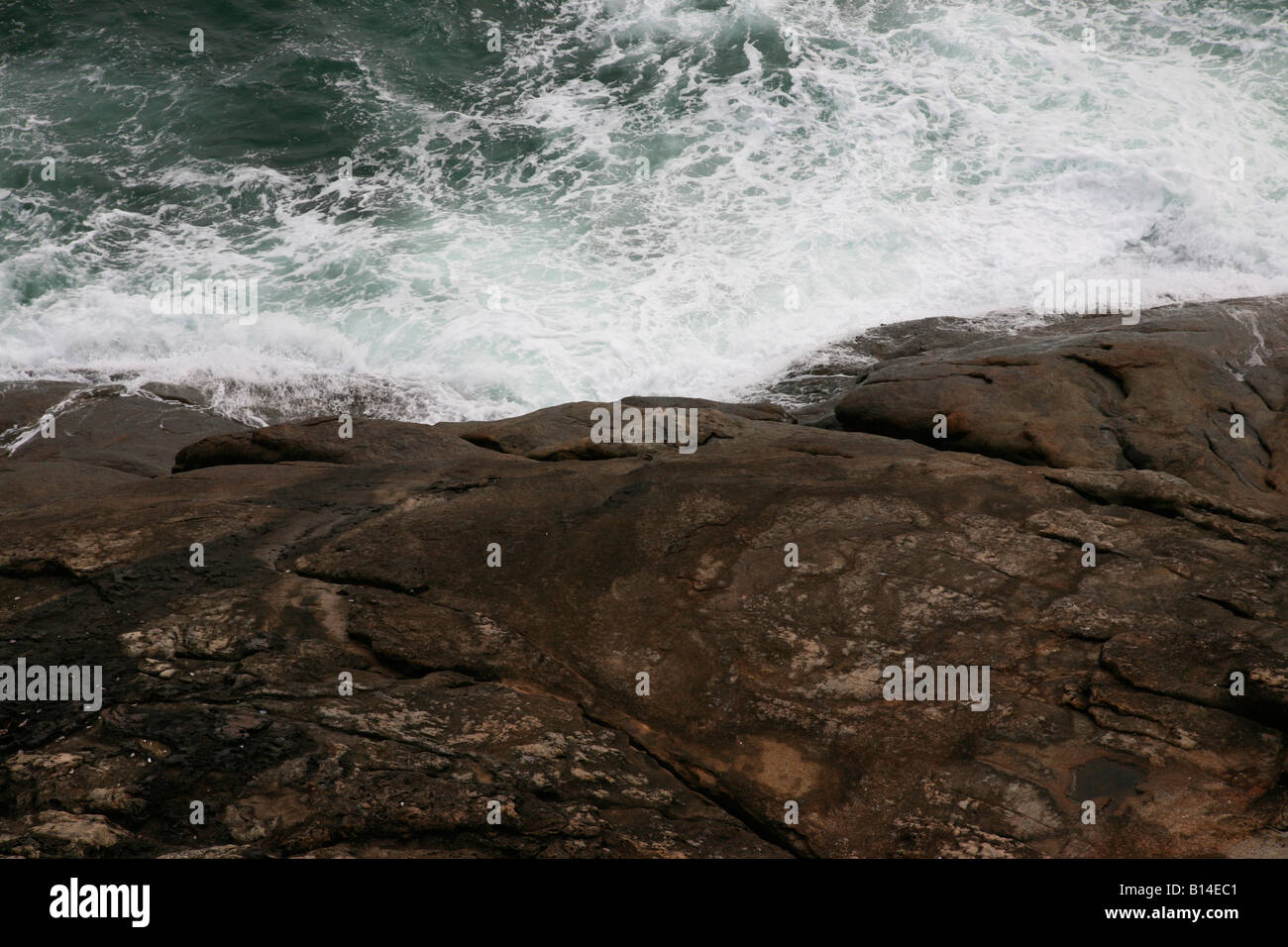 waves and rock at kovalam beach, kerala, india Stock Photo - Alamy