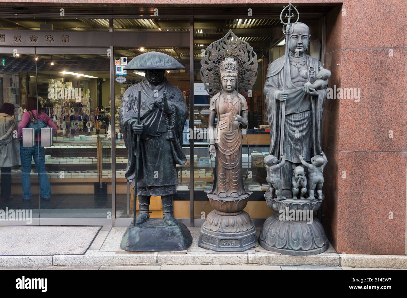 Kyoto, Japan. Statues of gods for sale outside a religious supplies ...